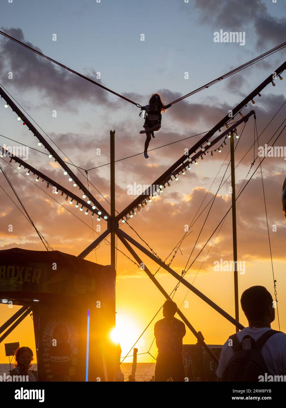 Batumi, Georgia. 09.10.2023 Silhouette of a child on an attraction. A ...
