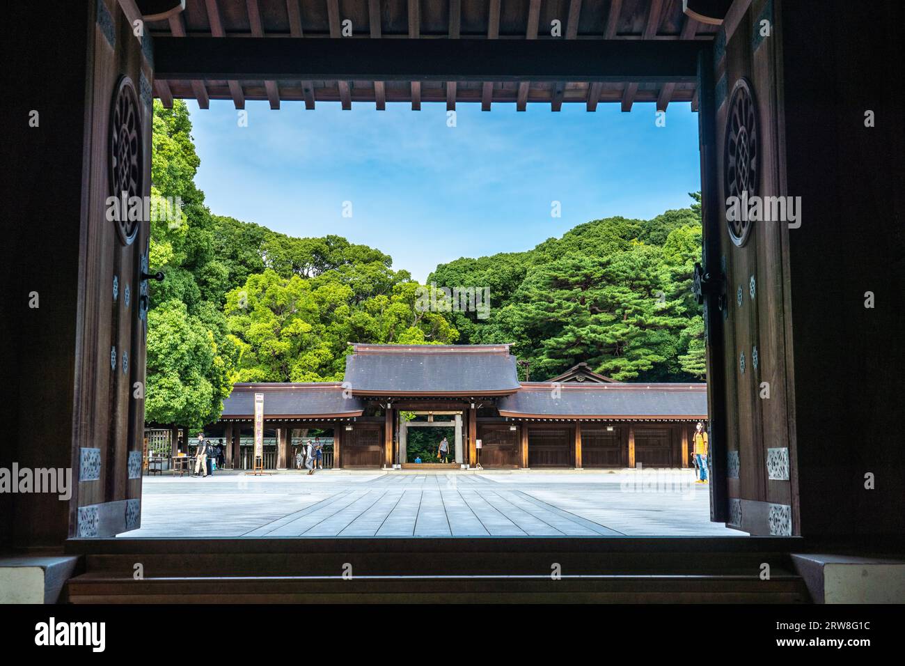 The massive wooden doors looking out at the Tamagaki sacred fence and ...