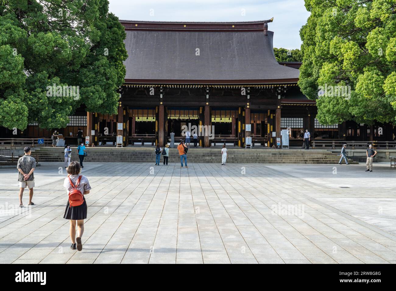 People inside the inner courtyard looking toward the main shrine ...