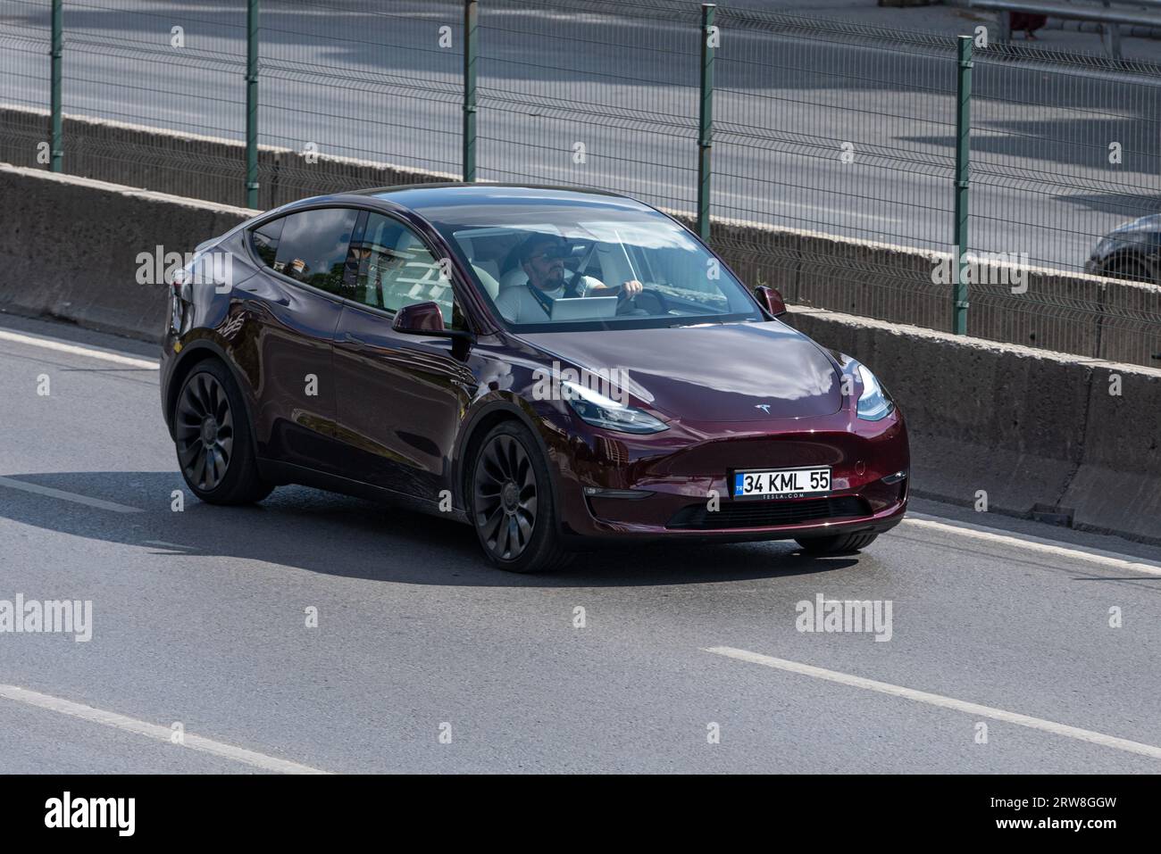 ISTANBUL, TURKEY -SEPTEMBER 17, 2023: A burgundy color Tesla Model Y on ...