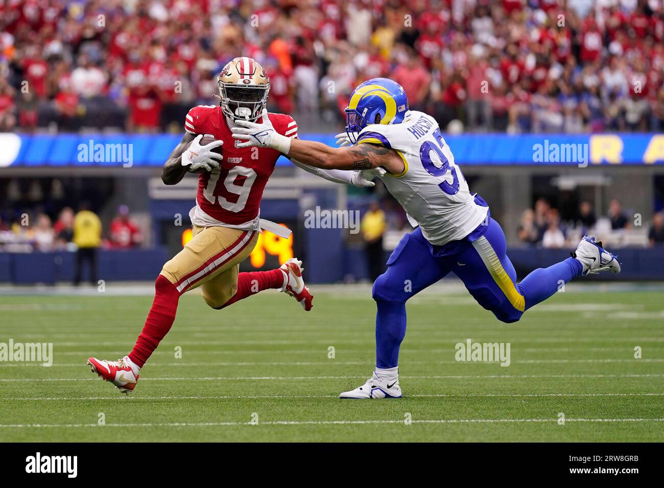 San Francisco 49ers wide receiver Deebo Samuel, left, tries to fend off ...