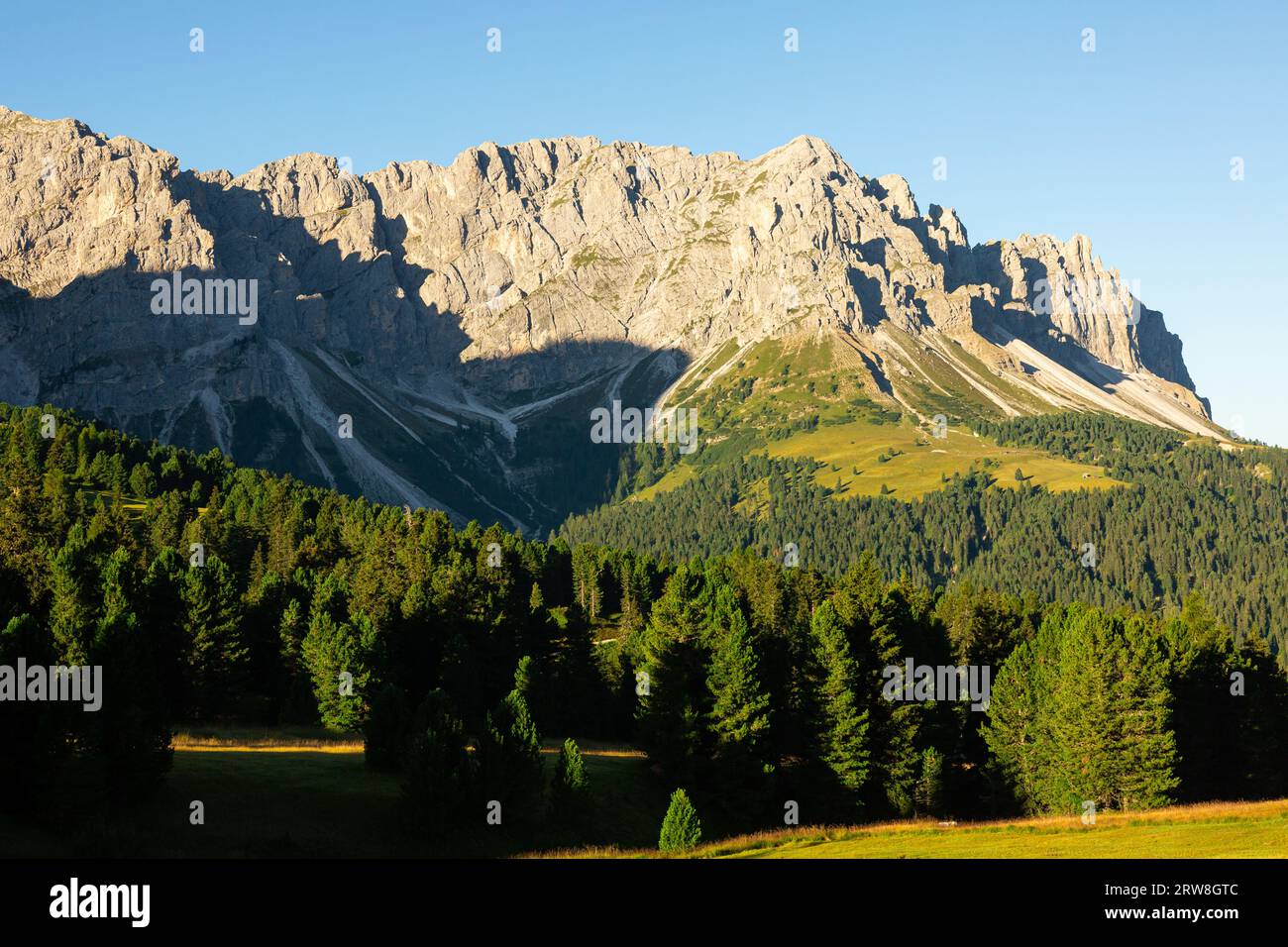 Munt de Fornella. View of famous Dolomites mountain peaks glowing in ...