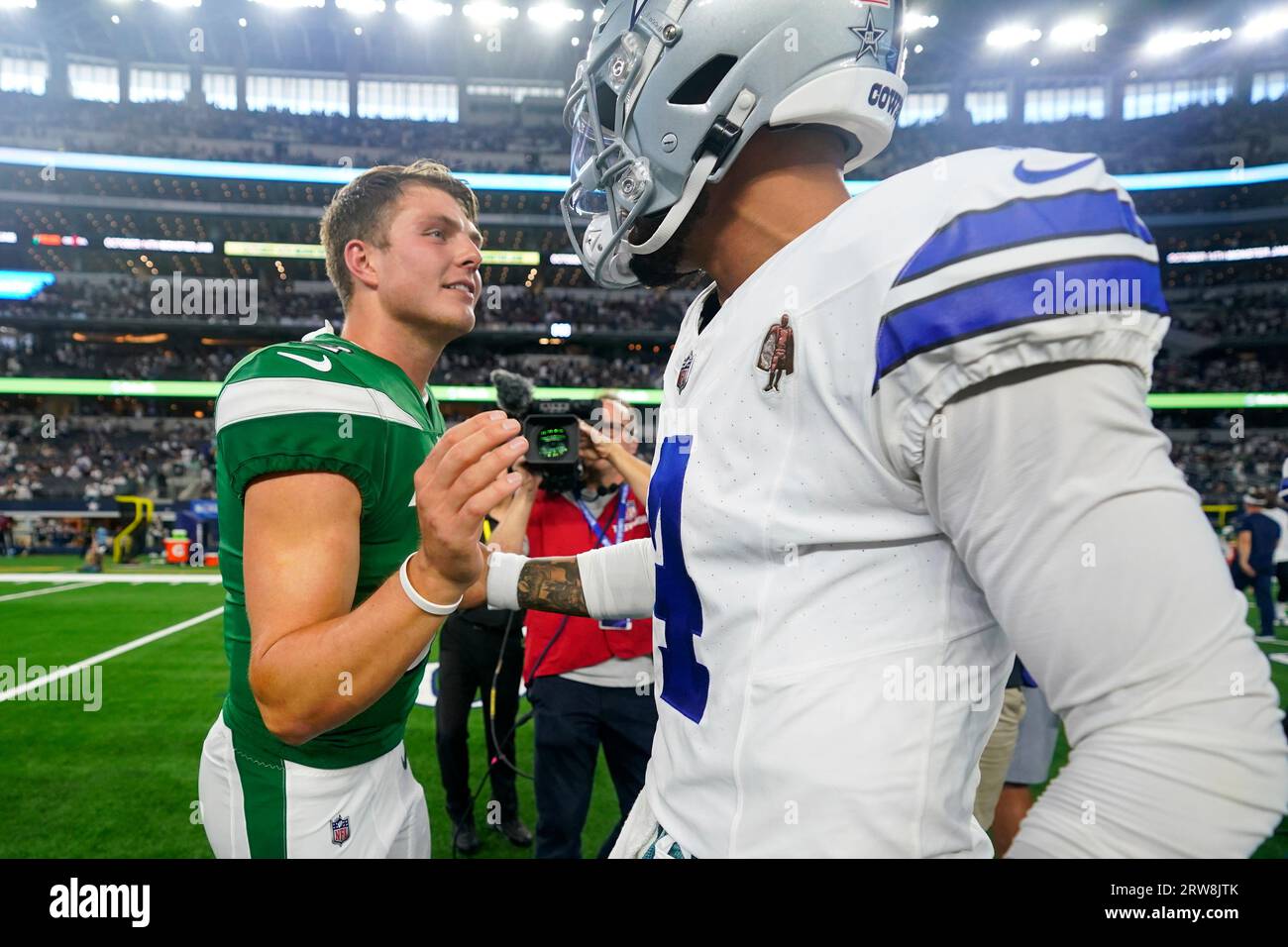 New York Jets quarterback Zach Wilson greets Dallas Cowboys quarterback ...