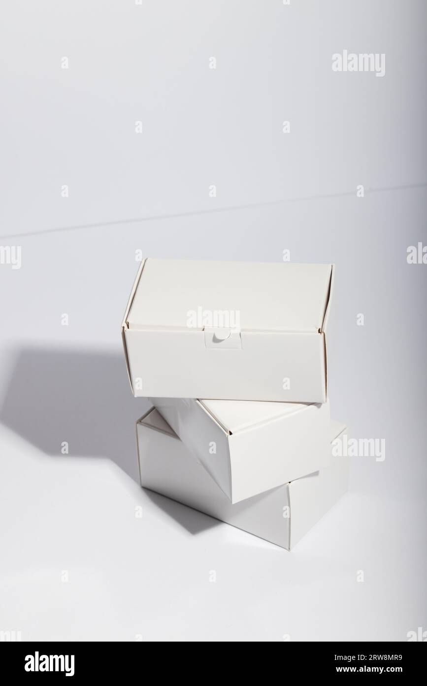 Vertical image of stack of cardboard gift boxes with copy space over ...