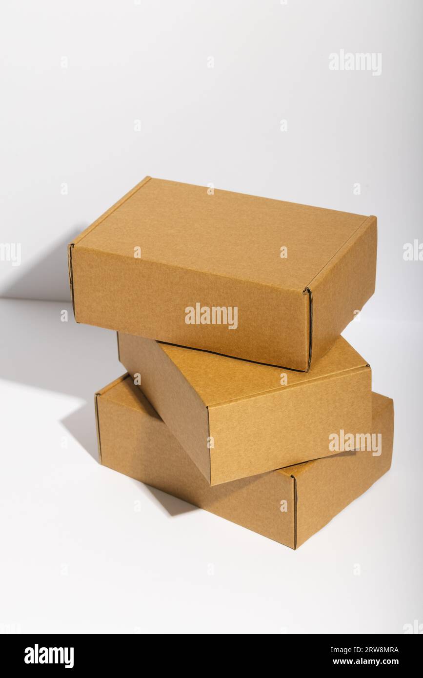 Vertical image of stack of cardboard gift boxes with copy space over ...