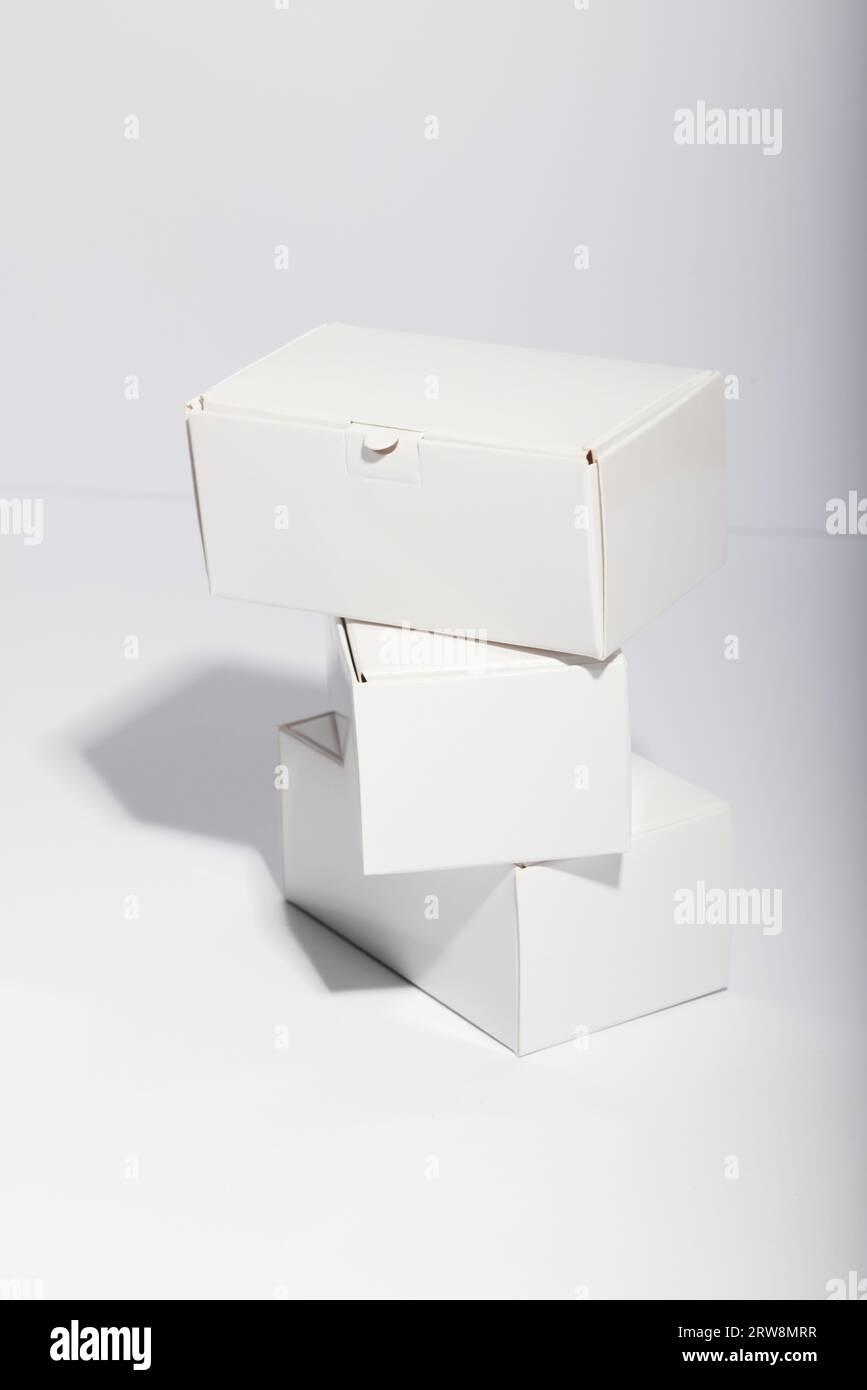 Vertical image of stack of cardboard gift boxes with copy space over ...