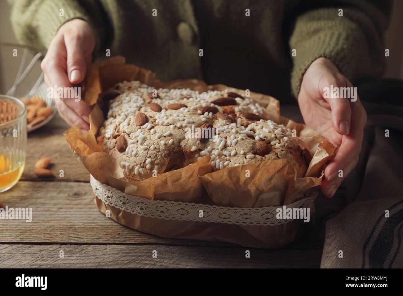 Woman with delicious Italian Easter dove cake (traditional Colomba di ...