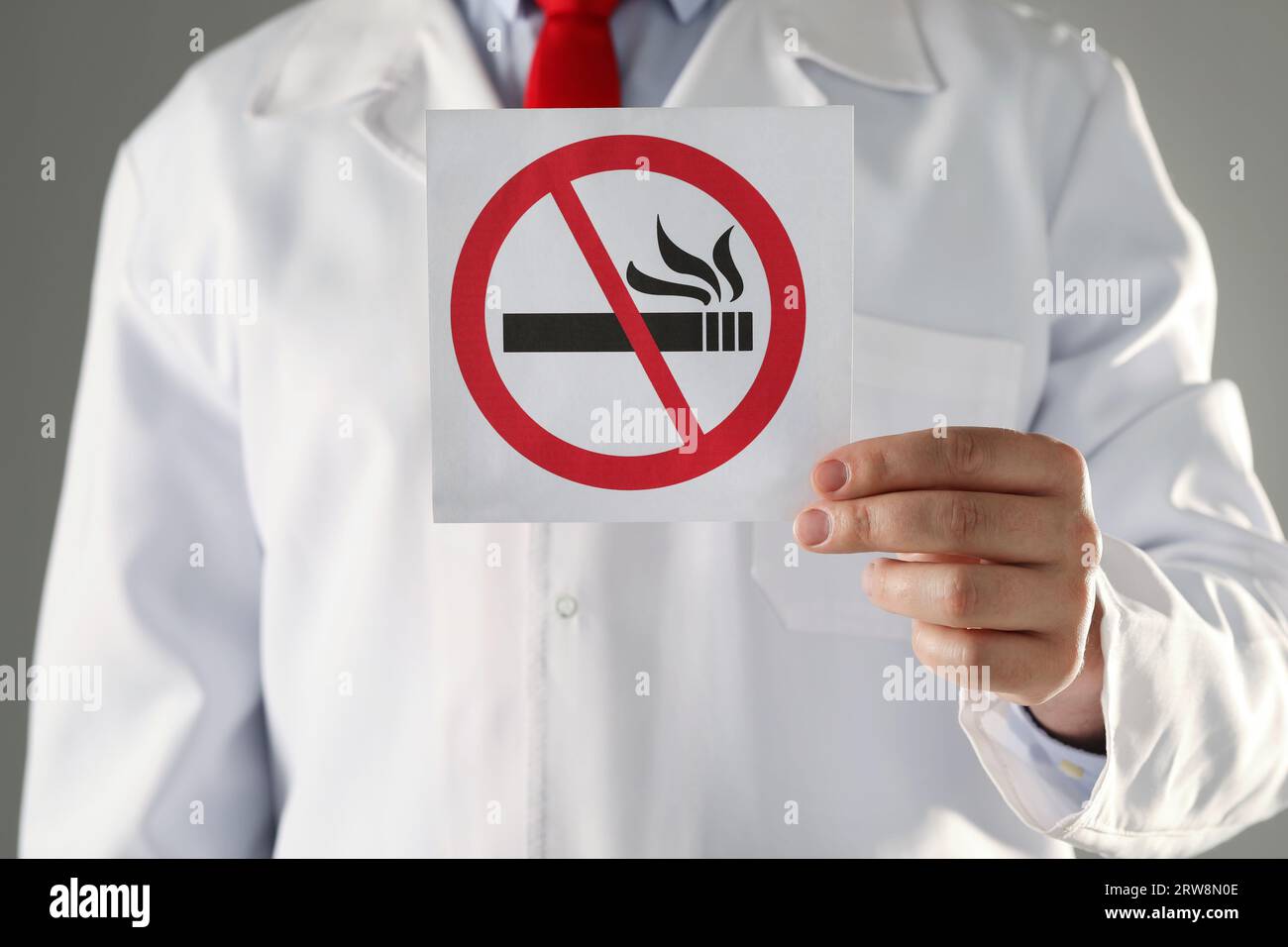 Doctor holding stop sign warning hi-res stock photography and images ...
