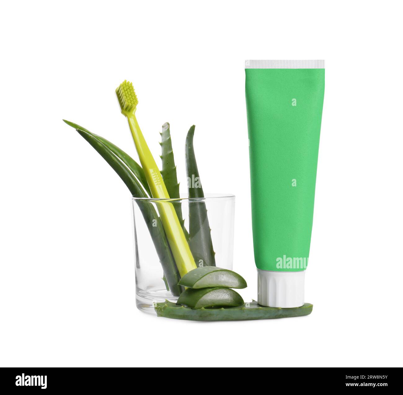 Tube of toothpaste, brush and aloe vera leaves on white background ...