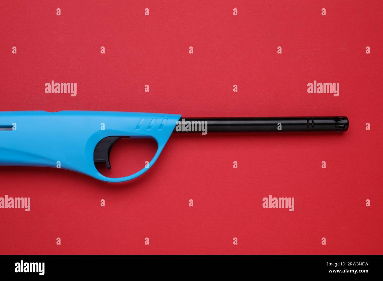 One gas lighter on red background, top view Stock Photo - Alamy