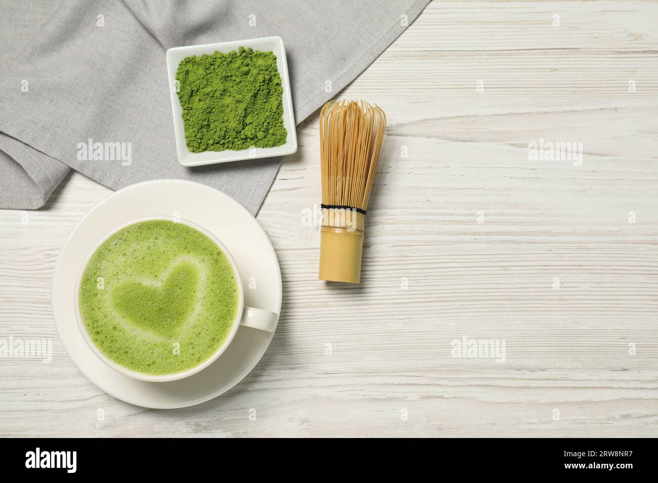 Flat lay composition with tasty matcha latte on white wooden table ...