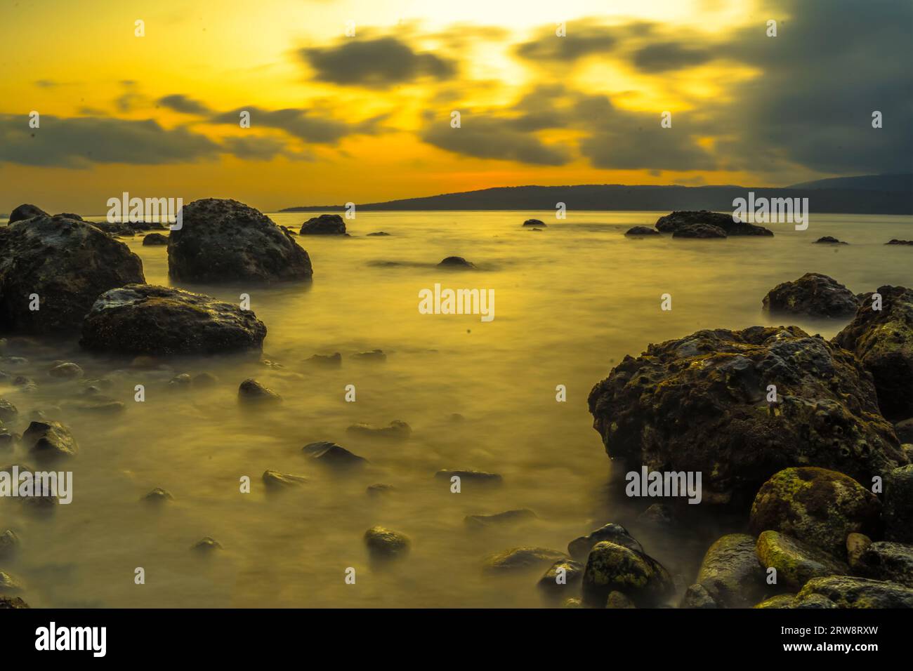 The stunning sunrise view in the Bali Strait, Indonesia, with a ...