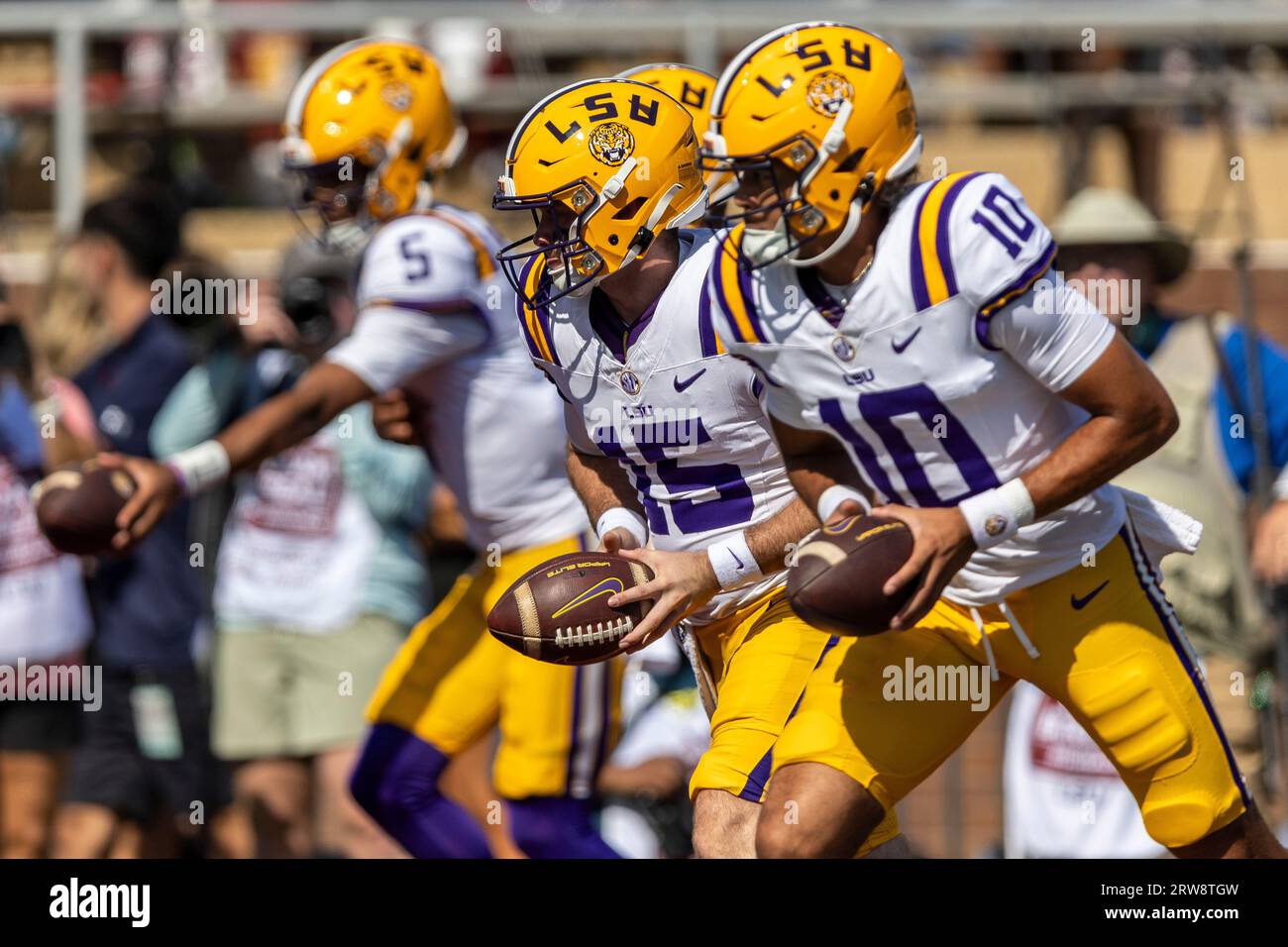 LSU quarterbacks Matt O'Dowd (15) and Rickie Collins (10) warm up ...