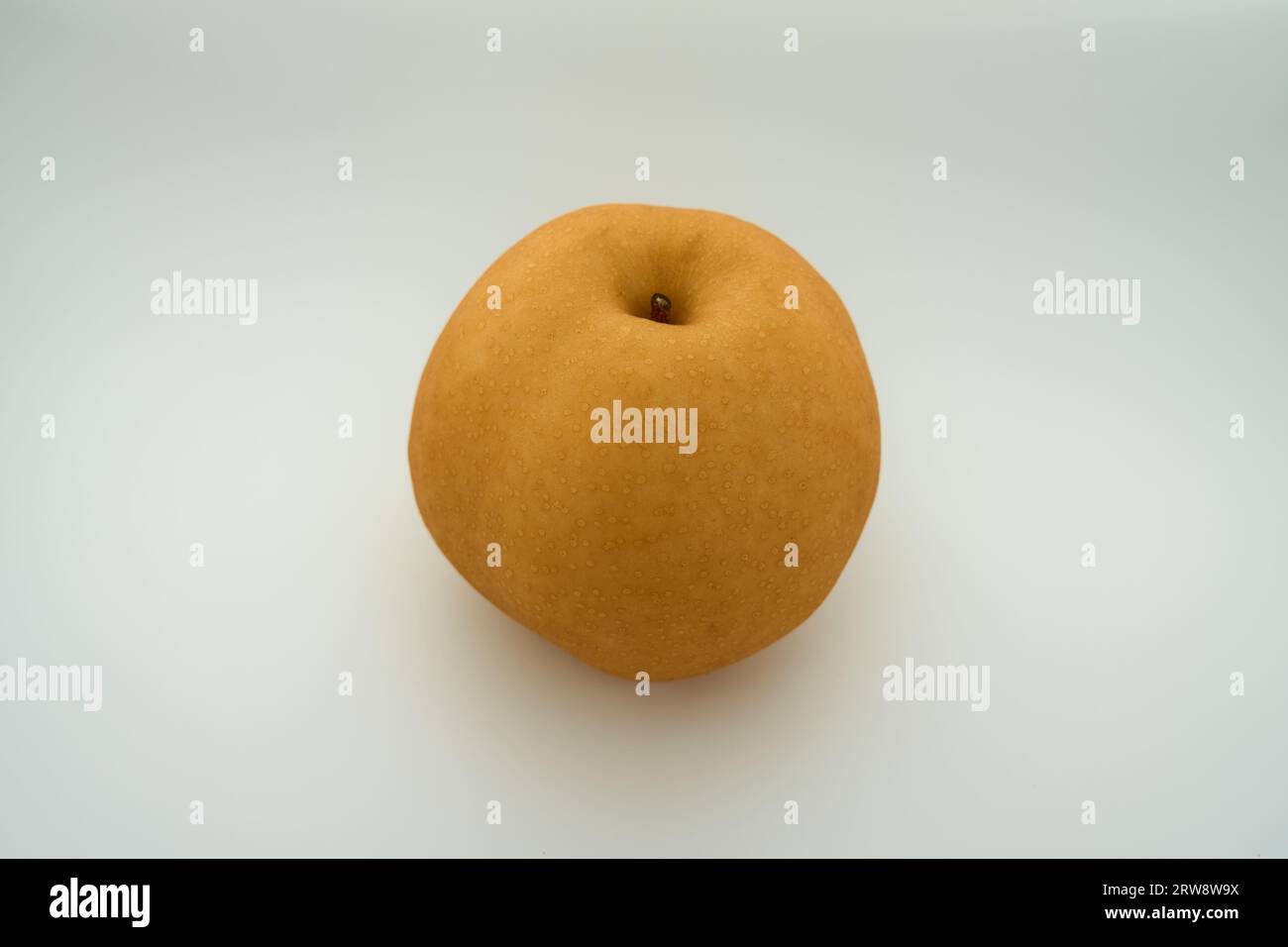 A side view of a juicy pear, white background Stock Photo - Alamy