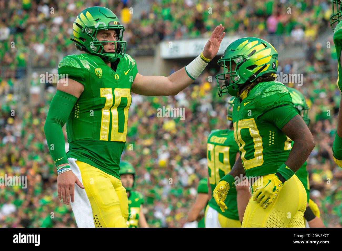 Oregon quarterback Bo Nix (10) and running back Jordan James (20 ...