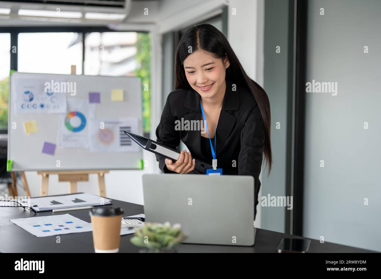 Woman bending over table hi-res stock photography and images - Alamy