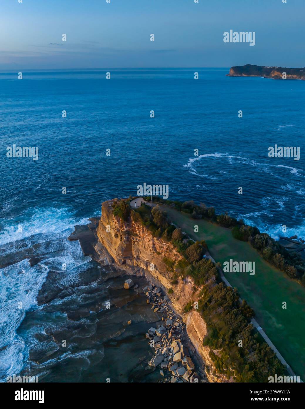 Aerial sunrise seascape from the rocky inlet known as The Skillion in Terrigal, NSW, Australia ...