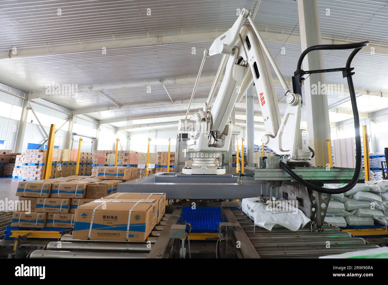 The manipulator is handling goods in a factory, North China Stock Photo ...