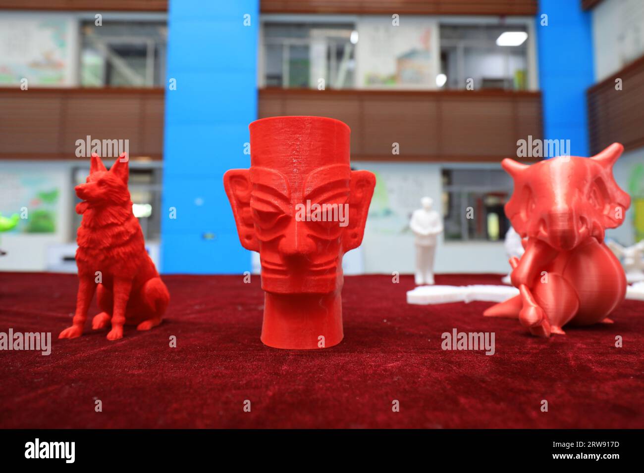 The red 3D print is on the table Stock Photo - Alamy