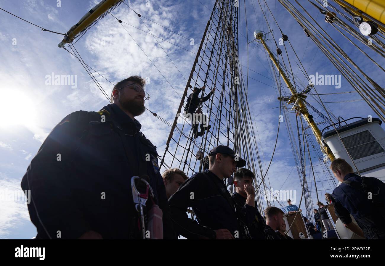 Kiel, Germany. 14th Sep, 2023. The sail crew climbs into the rigging to ...