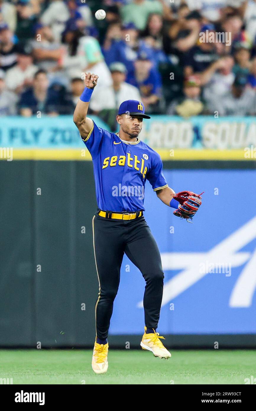 Seattle Mariners center fielder Julio Rodriguez throws after catching a ...