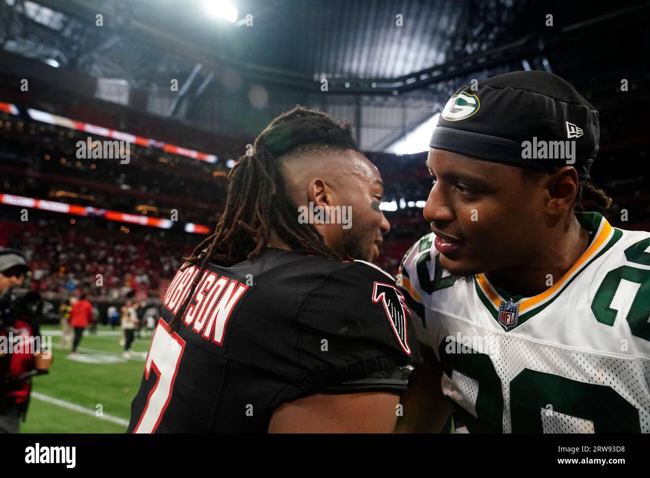 Atlanta Falcons running back Bijan Robinson (7) embraces Green Bay ...