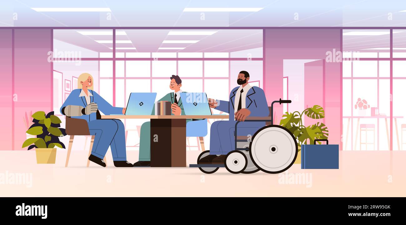 group of young disabled men and women meeting in inclusive classroom ...