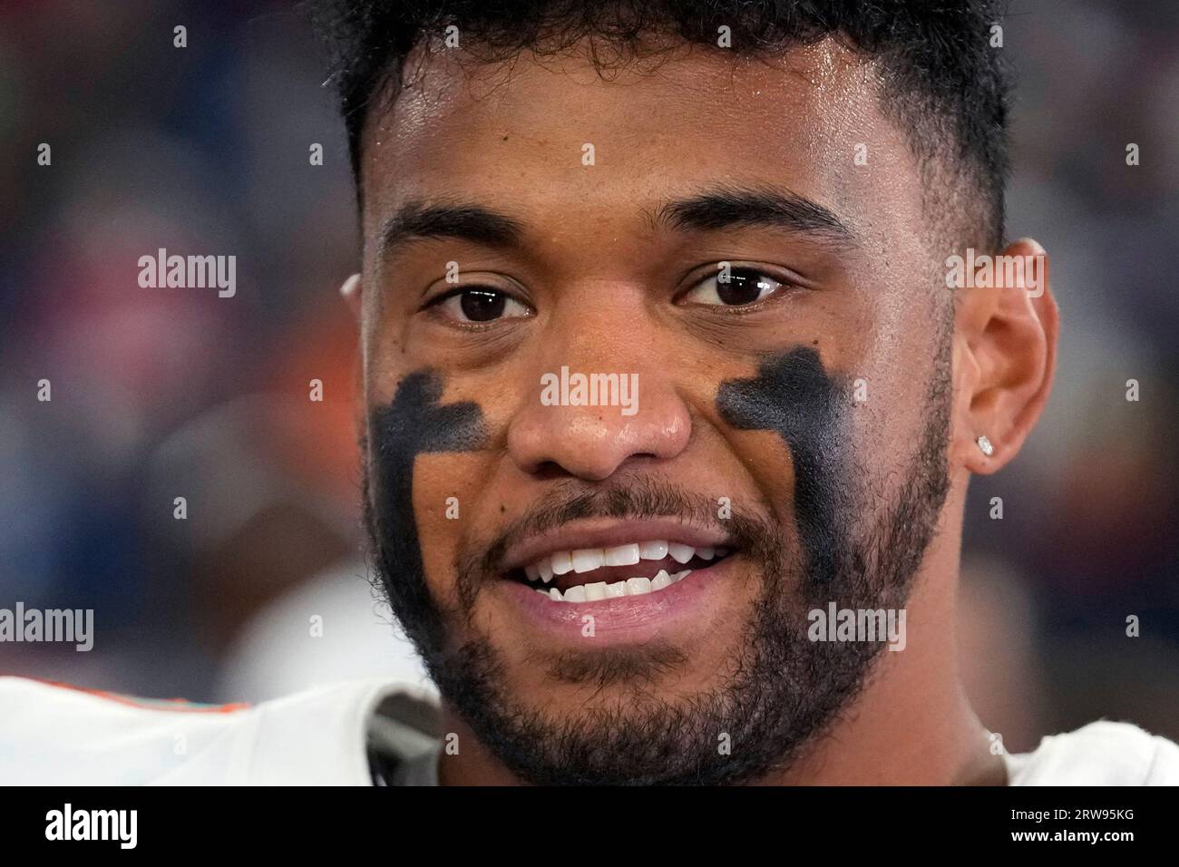 Miami Dolphins quarterback Tua Tagovailoa smiles after defeating the ...