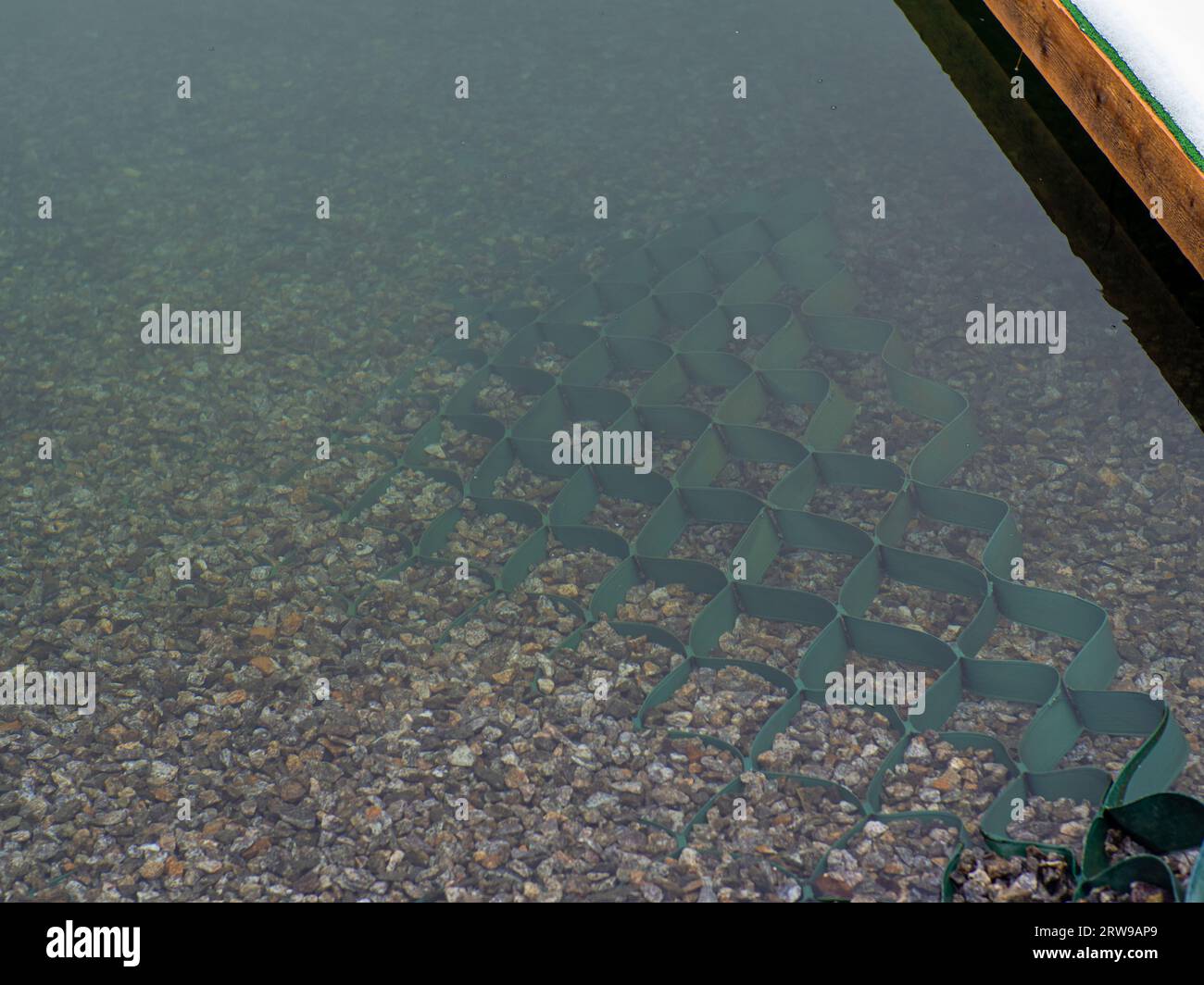 Green polymer geogrid to strengthen the river bank Stock Photo - Alamy