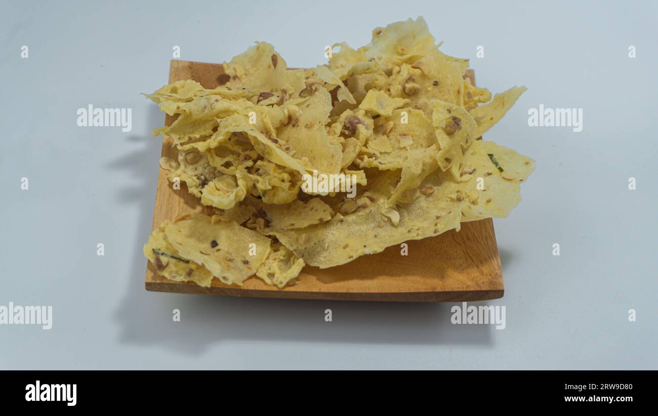 Kacang rempeyek or peyek. crackers made from peanuts mixed with rice ...