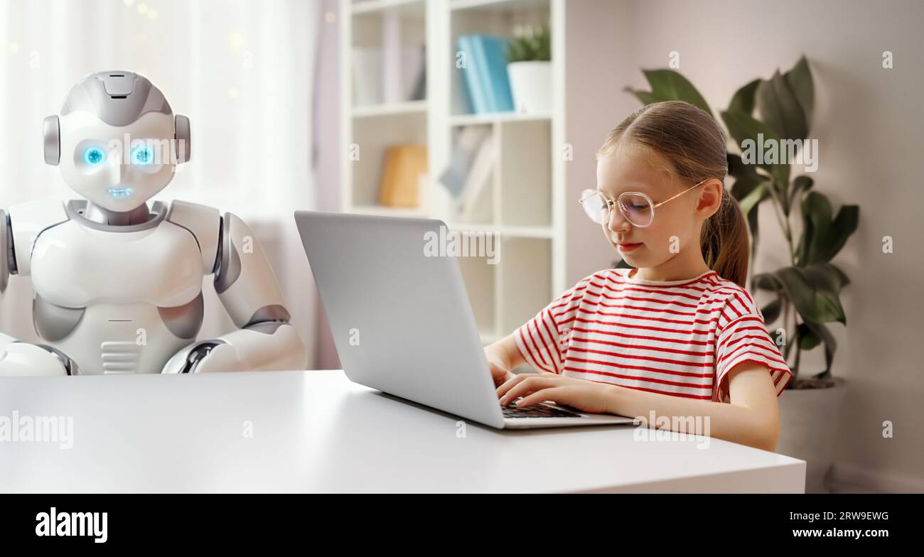 A cute girl is playing with a robot. The concept of future training ...