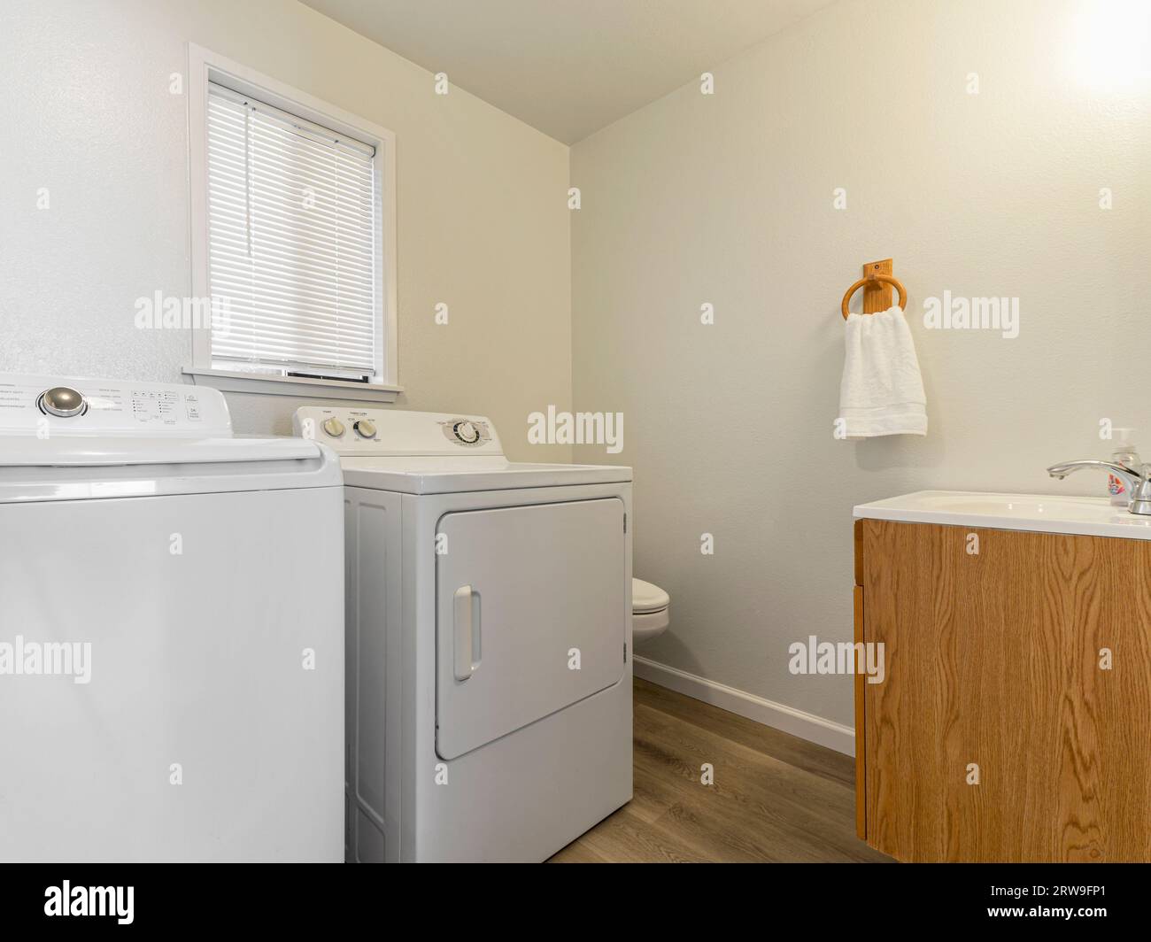 Modern residential bathroom and laundry room interior Stock Photo - Alamy
