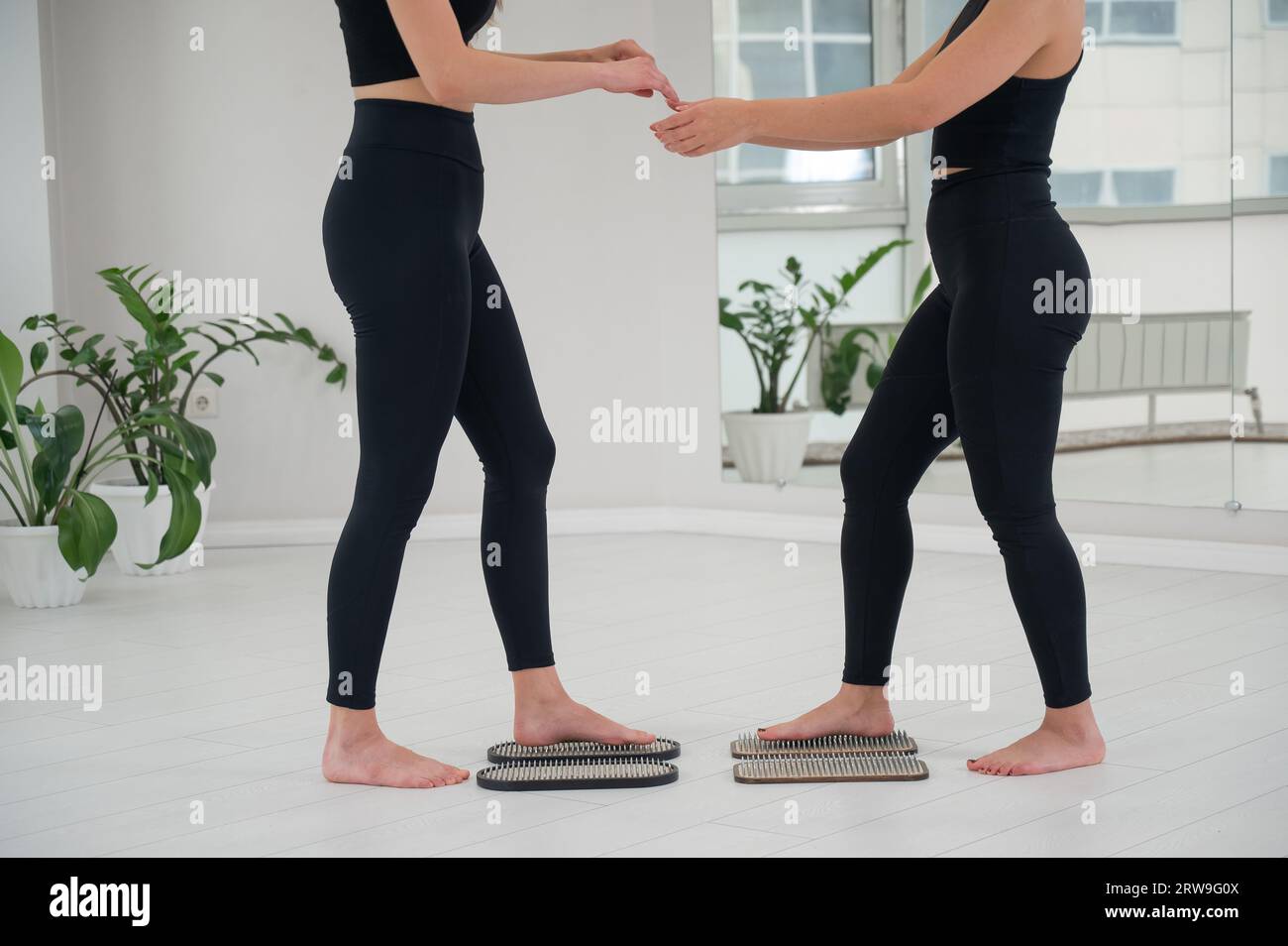 Caucasian and Asian women stand up sadhu boards together Stock Photo ...