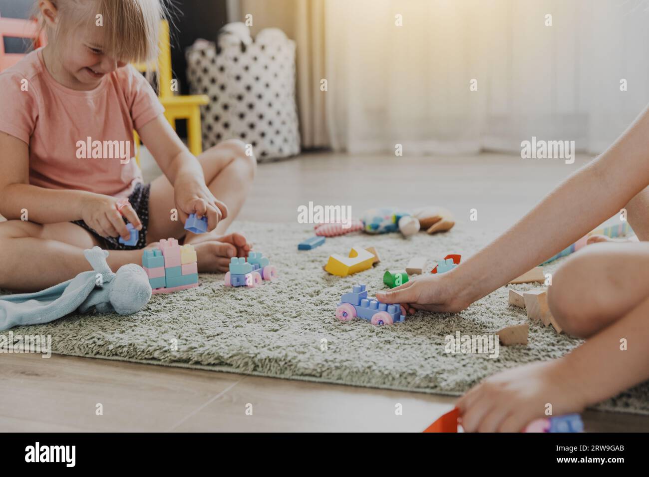Children playing with colorful plastic toy colourful train. Kids ...