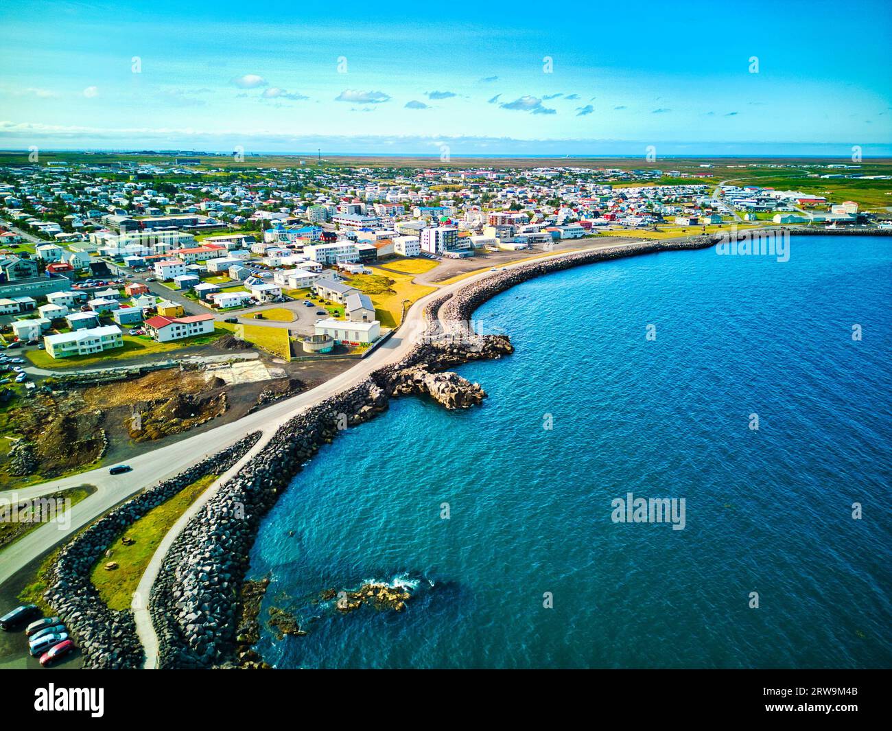 Aerial view of a coastal city, featuring a beach area and its ...