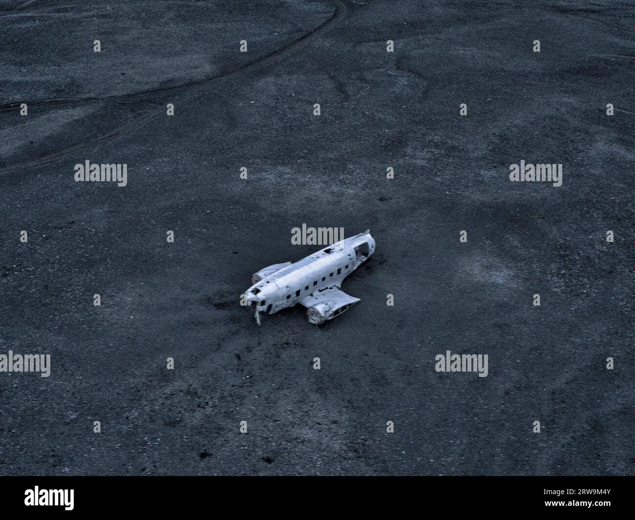 A small plane has successfully touched down on a sparsely paved dirt ...