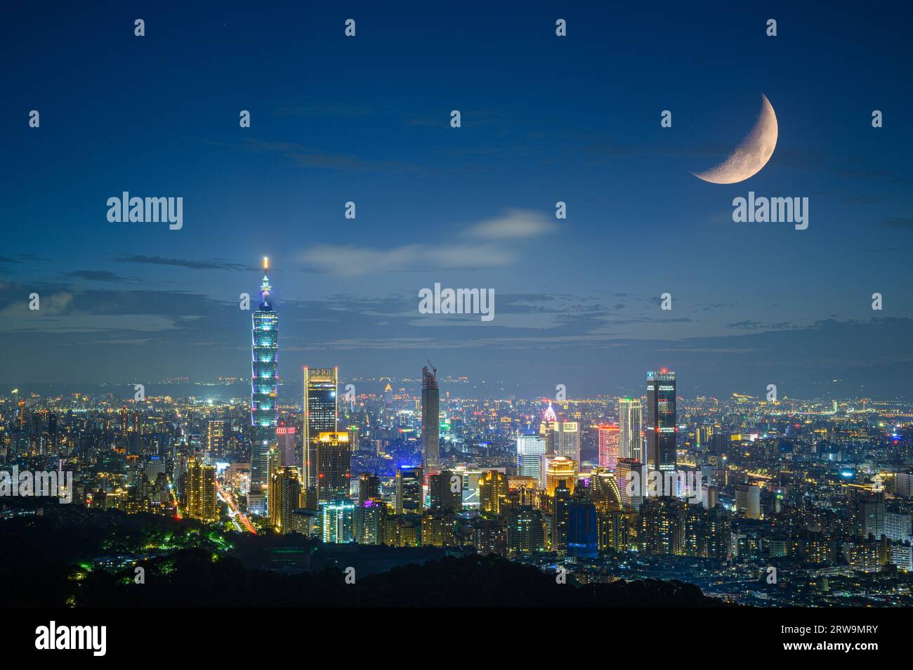 Urban splendor at night: Watch the dynamic clouds and moon above the ...