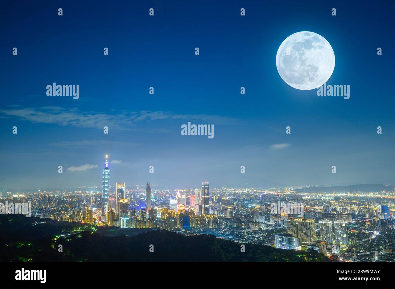 Urban splendor at night: Watch the dynamic clouds and moon above the ...