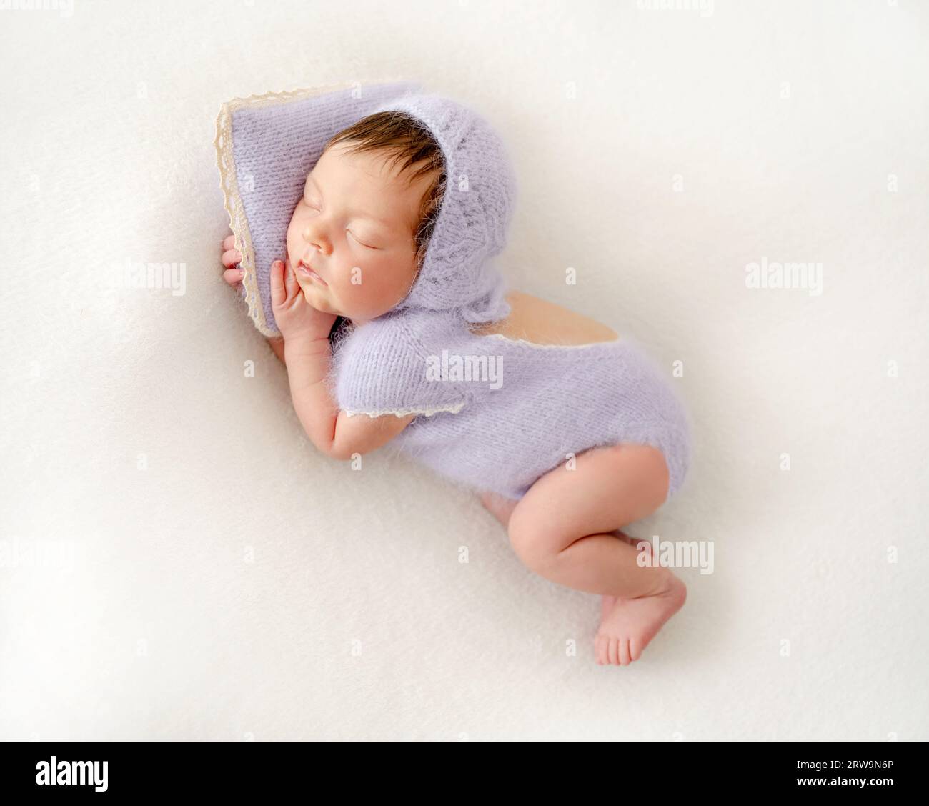 Adorable newborn baby girl sleeping on pillow. Cute infant child kid in ...