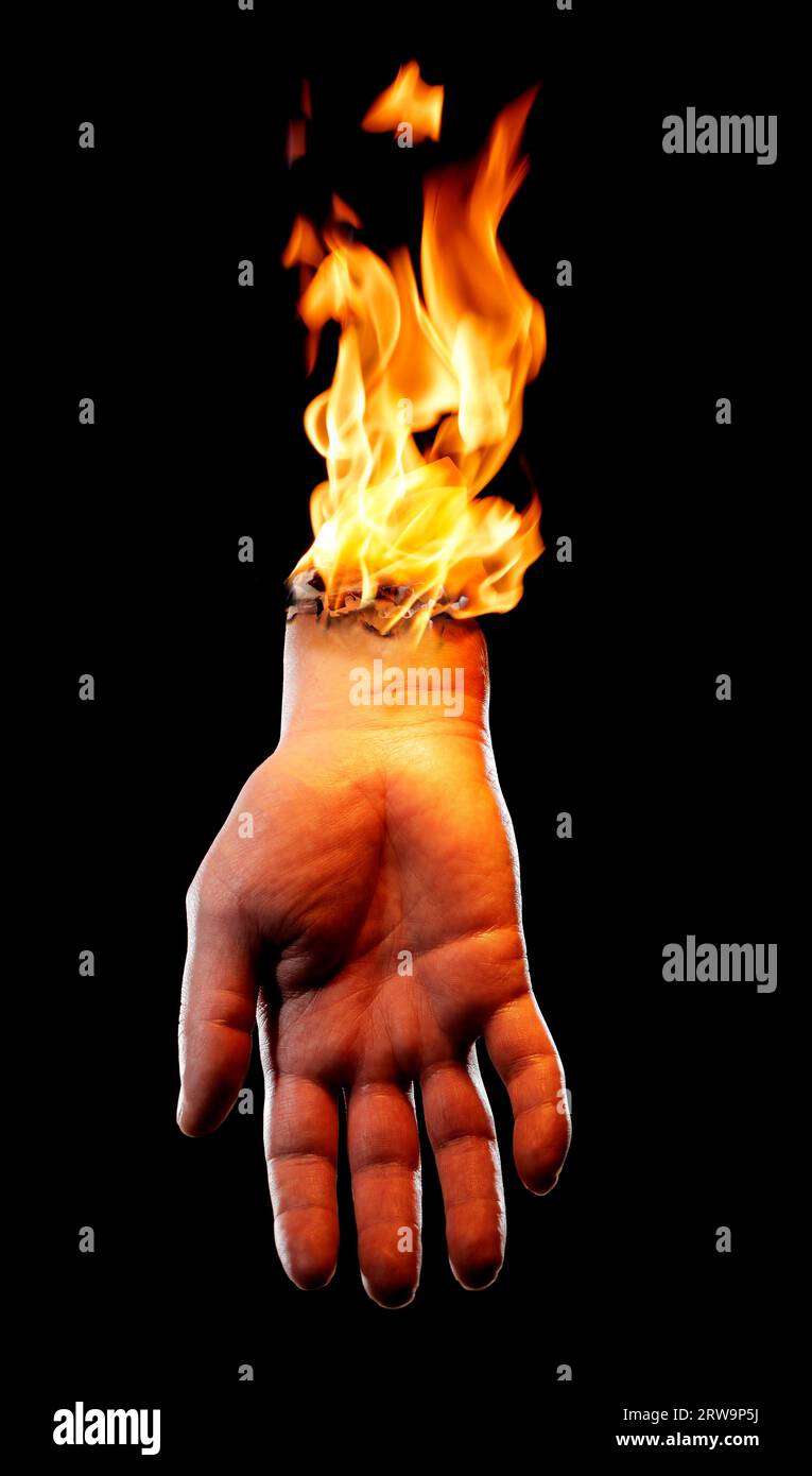A Bizarre burning hand on black background Stock Photo - Alamy