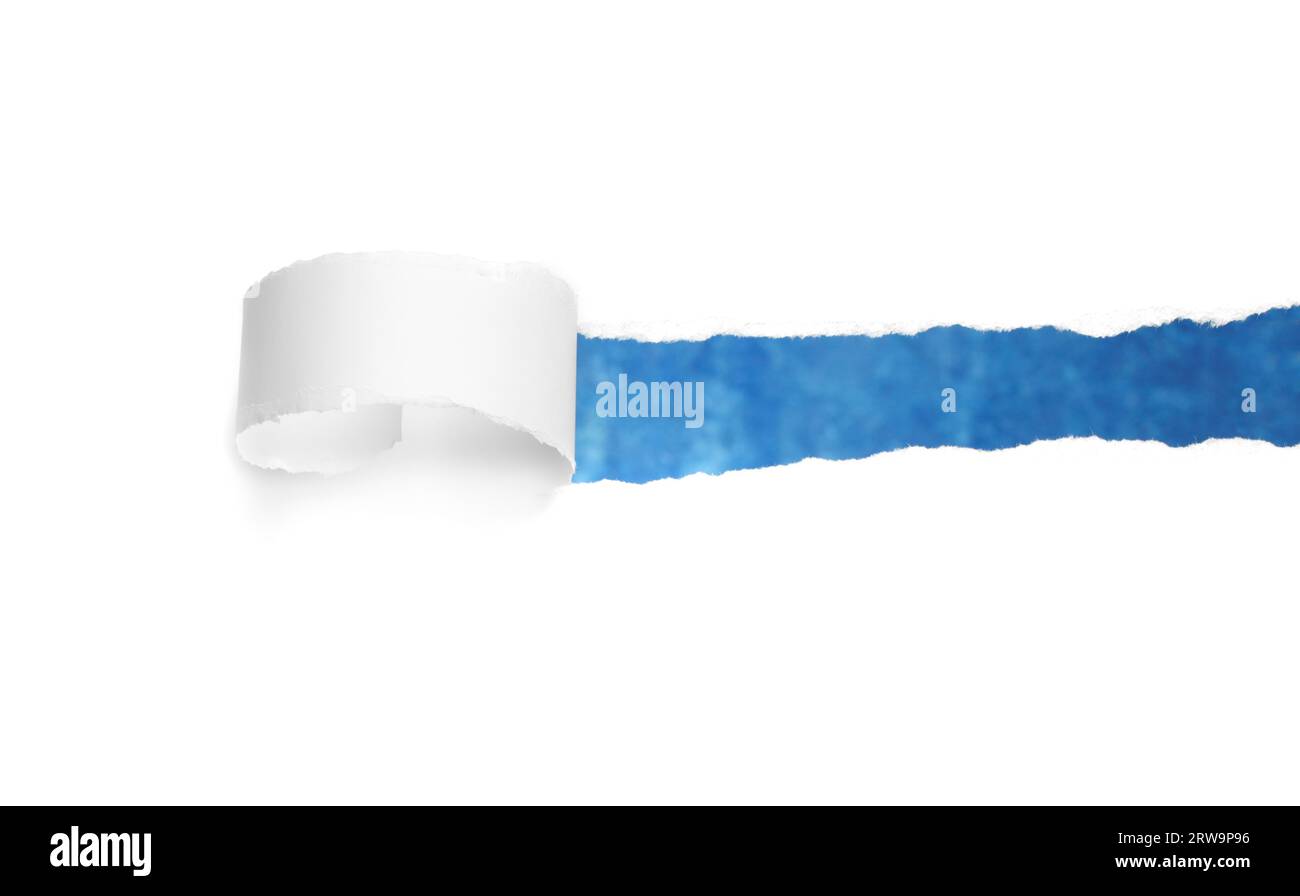 White torn paper revealing blue background Stock Photo - Alamy