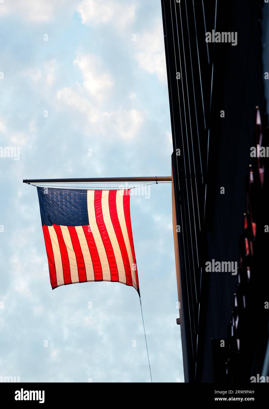 American flag hanging from building hi-res stock photography and images ...