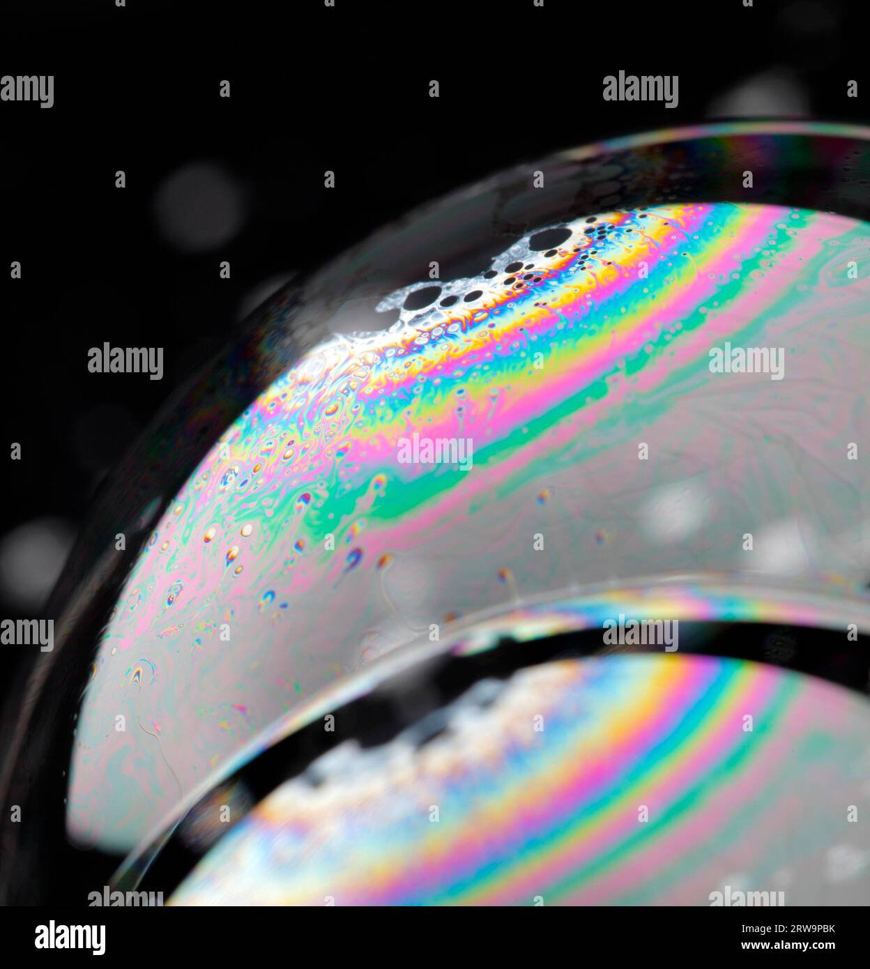 Closeup of soap bubbles. The iridescent colours of soap bubbles are ...