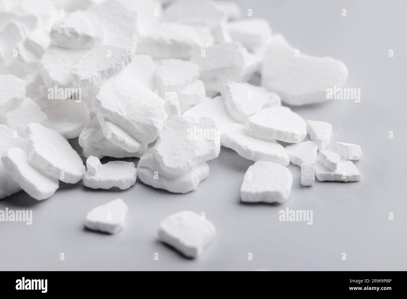 Calcium chloride (CaCl2) flakes. Common applications include brine for ...