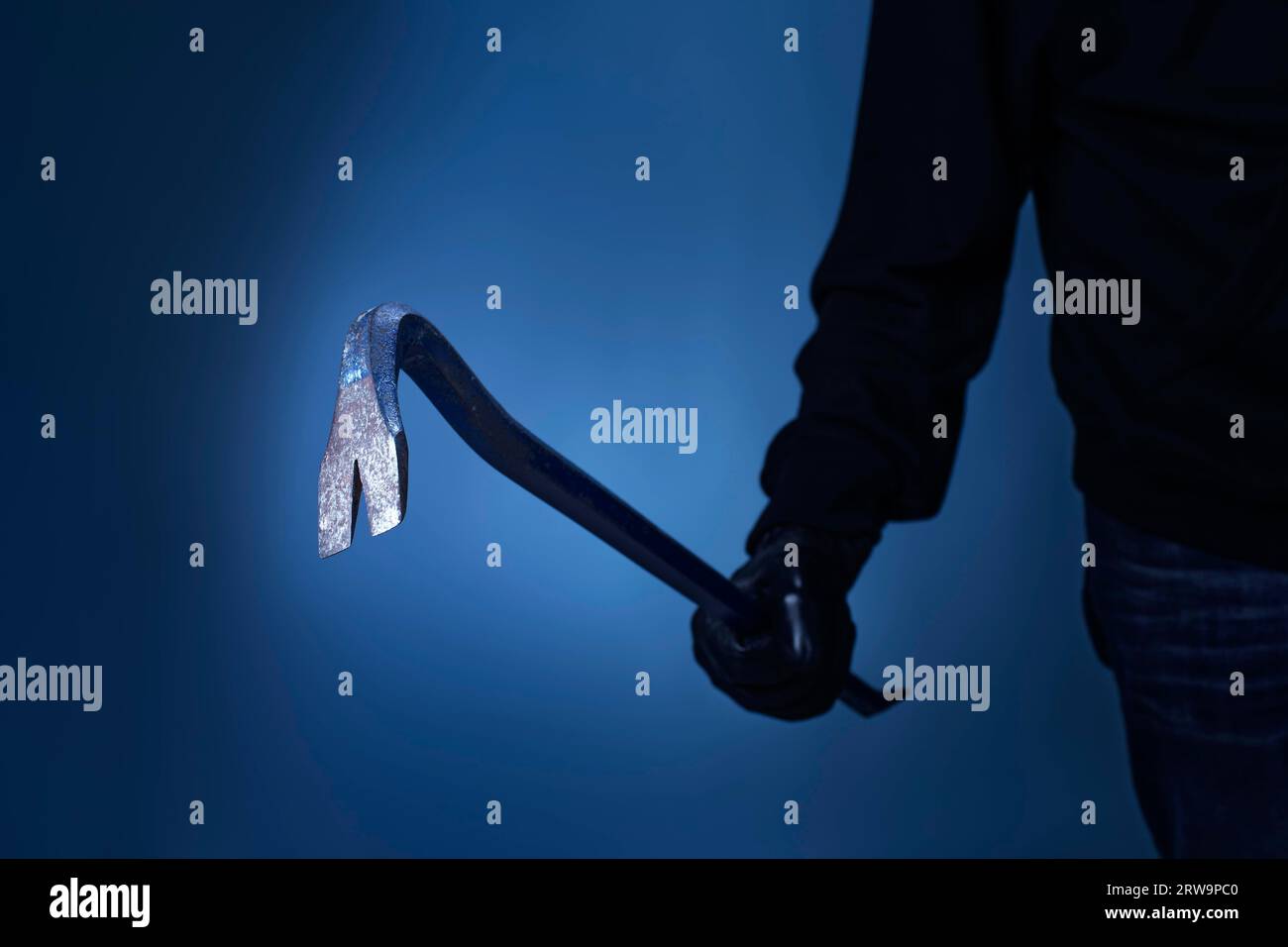 Burglar hand holding crowbar hi-res stock photography and images - Alamy