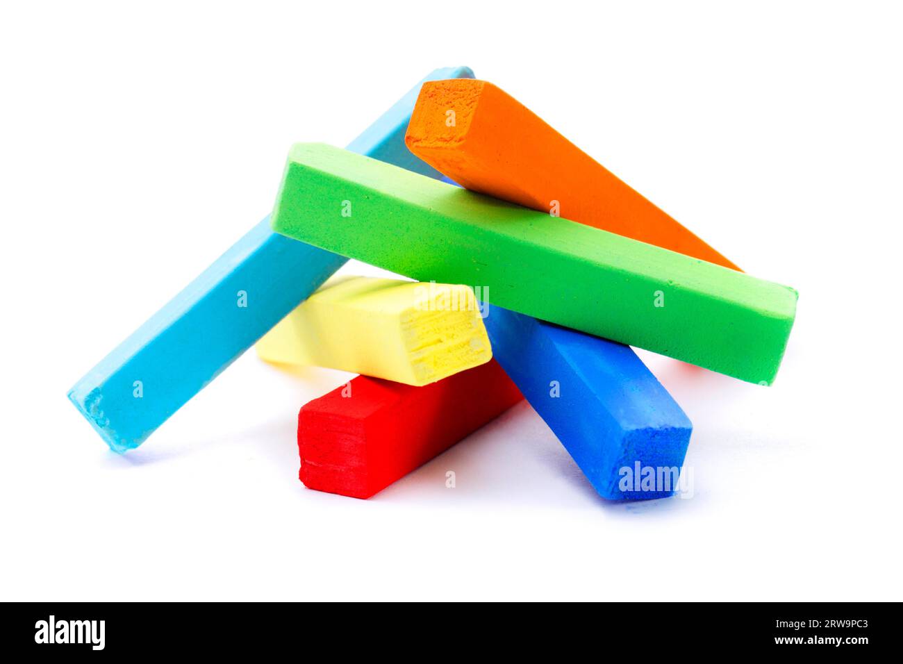Different color crayon pastels isolated on white with natural shadows ...
