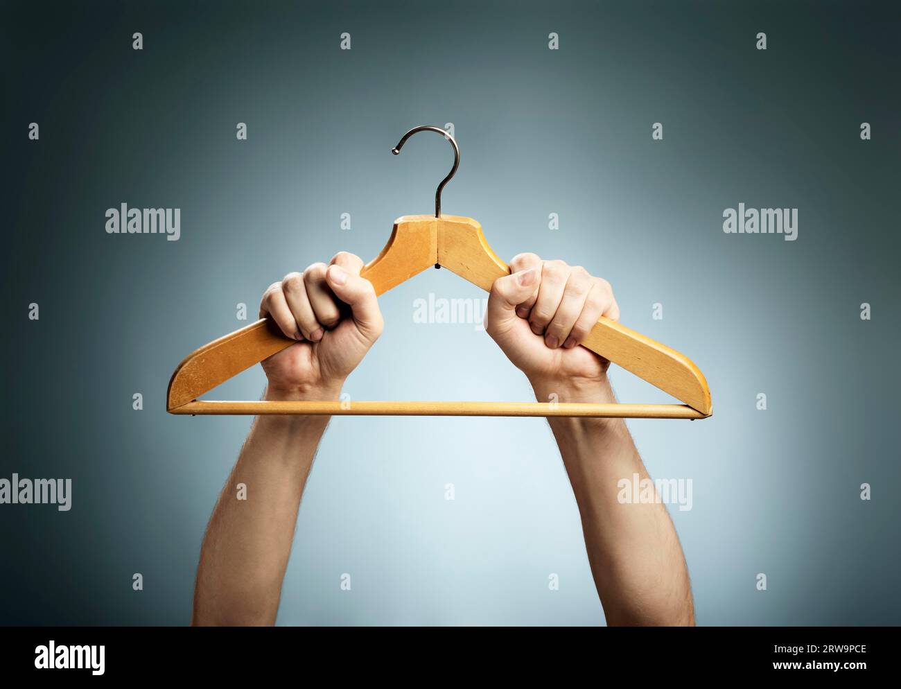 Hand clothes hanger hi-res stock photography and images - Alamy
