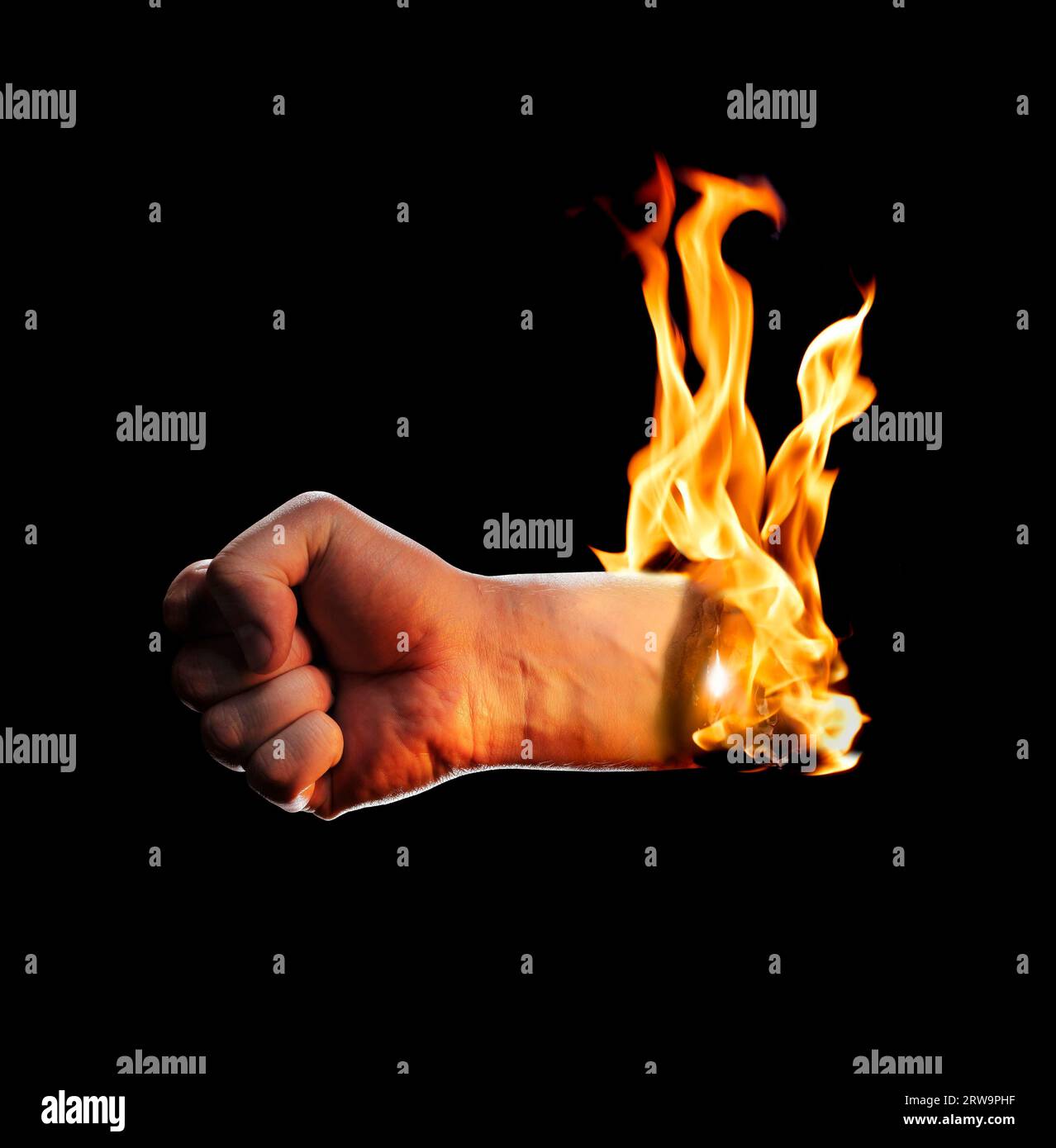 A burning fisted hand on black background Stock Photo - Alamy