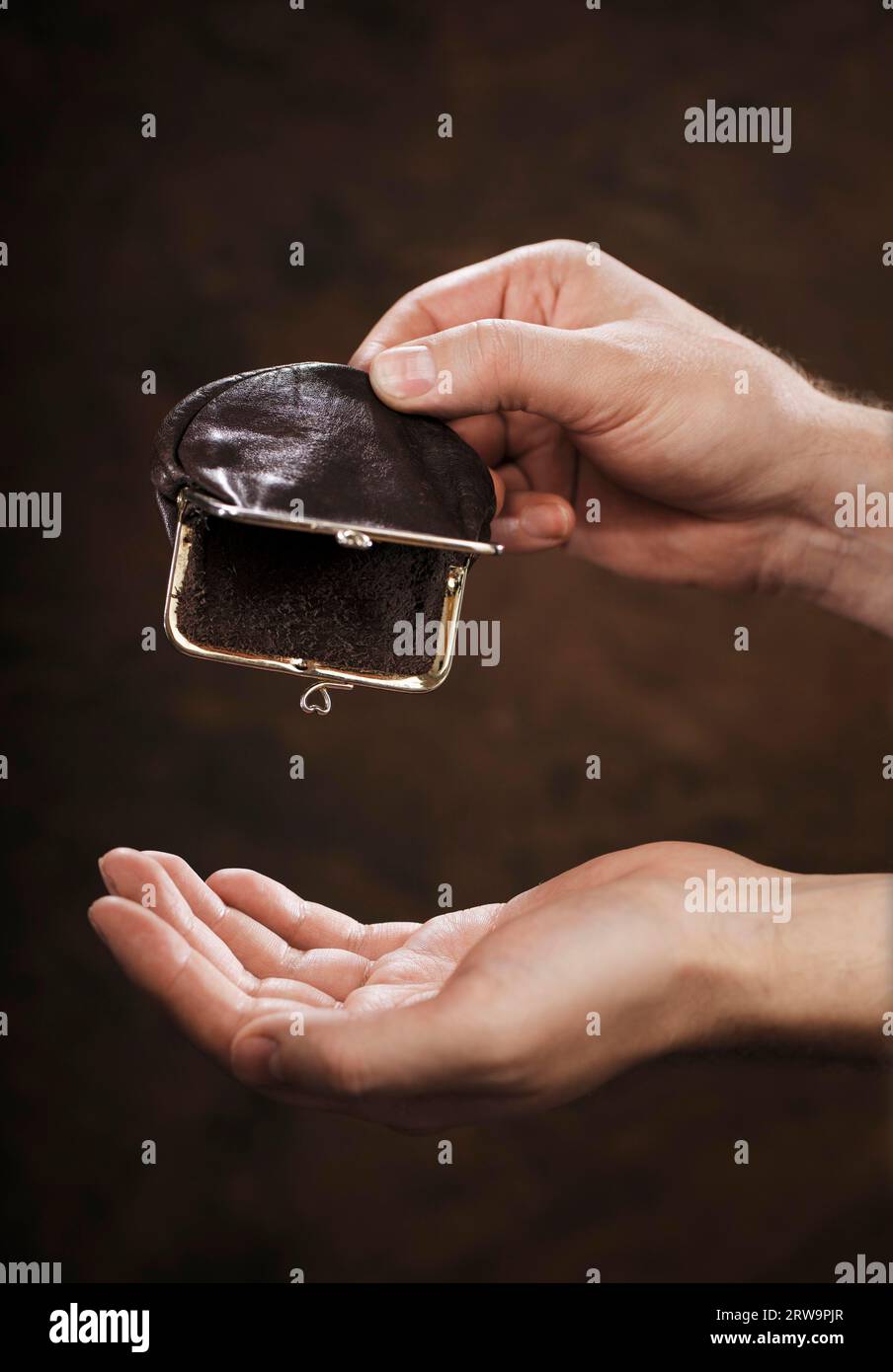 Male hand holding coin hi-res stock photography and images - Alamy
