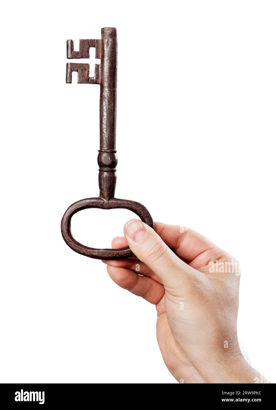 Man holding a big old antique skeleton key in his hand Stock Photo - Alamy